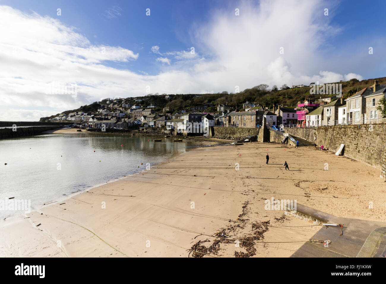 The harbour and harbourside at Mousehole, Cornwall, UK enjoying winter ...