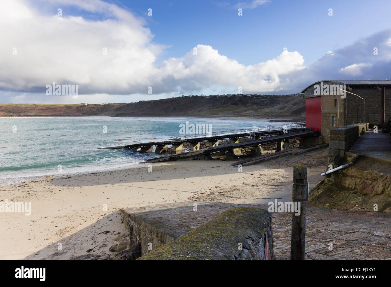 Sennen Cove Lifeboat station with launch ramps against a deserted late ...
