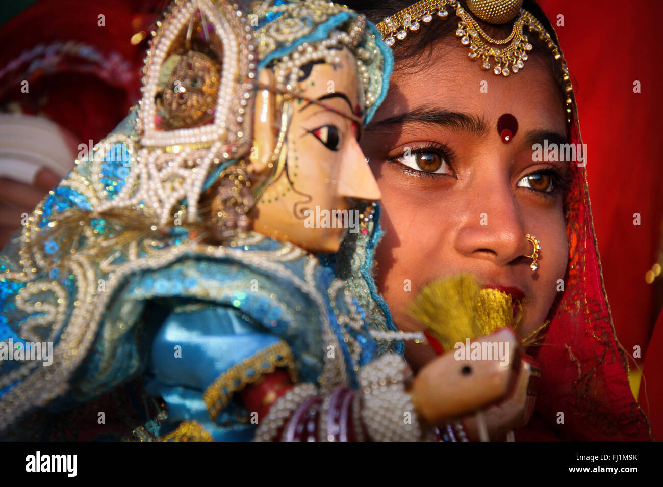 Young Rajasthani girl with puppet during Gangaur festival in Udaipur ...