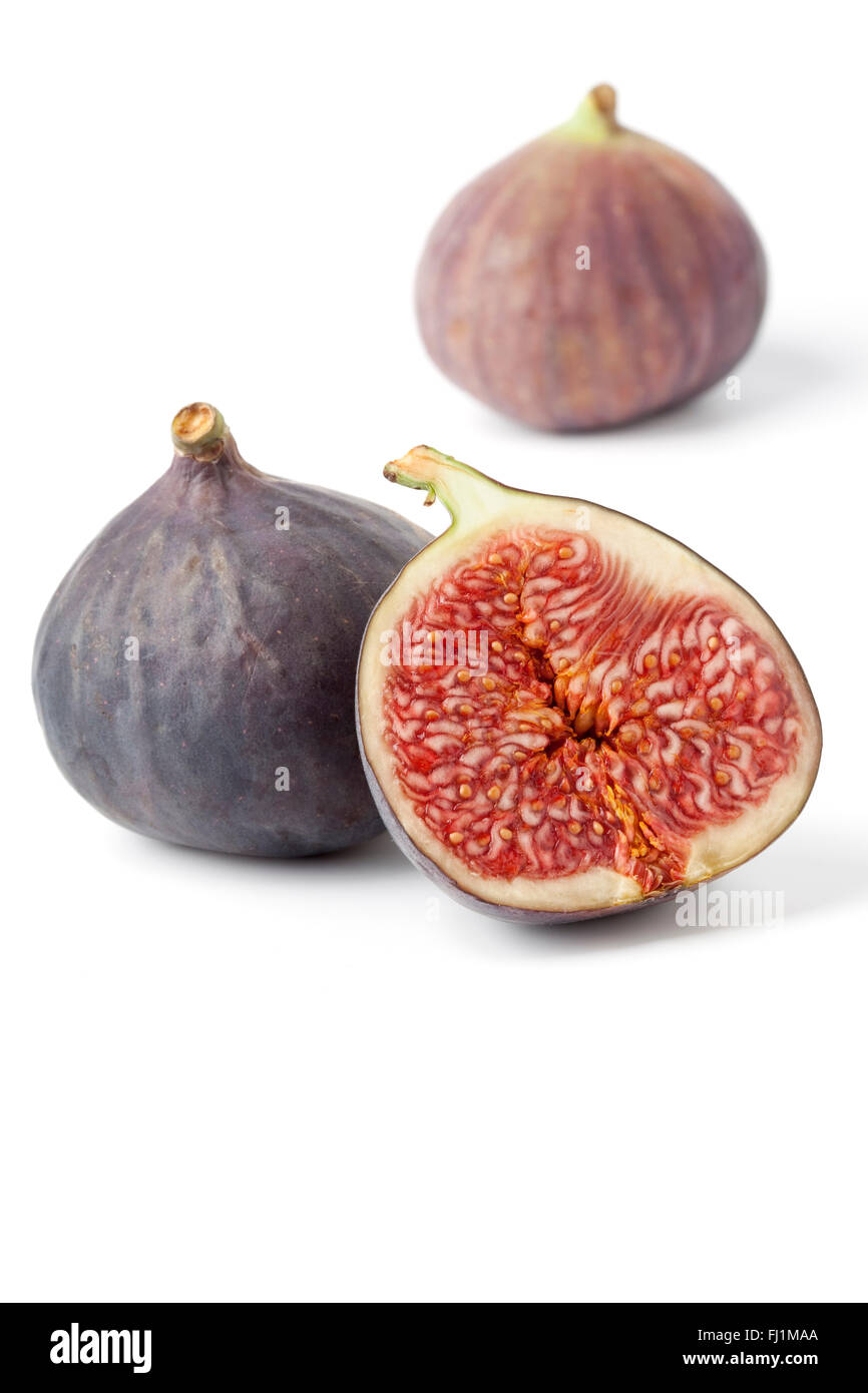 Fresh whole and half figs on white background Stock Photo - Alamy