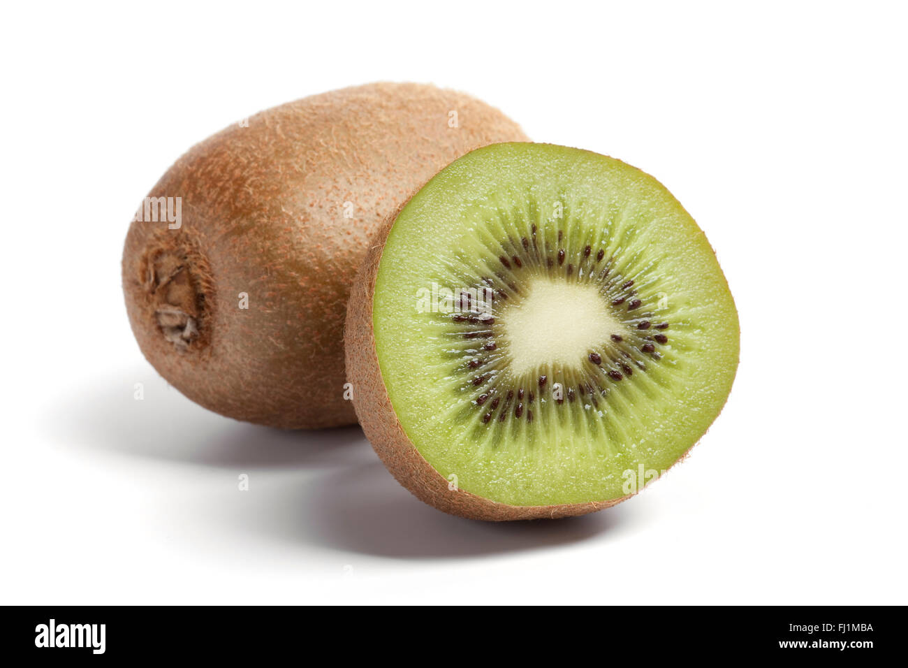 Fresh ripe one and a half kiwi on white background Stock Photo - Alamy