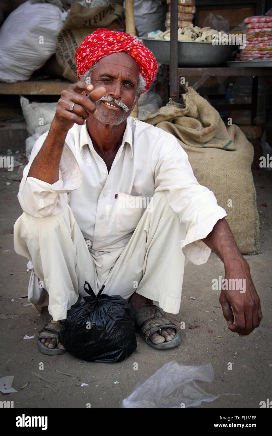 Nice rajasthani man giging a wink with red turban and moustache in ...
