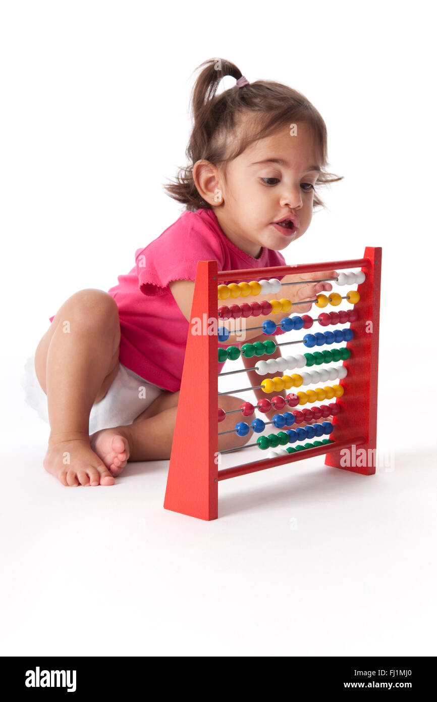 Baby girl counting with help of an abacus on white background Stock ...