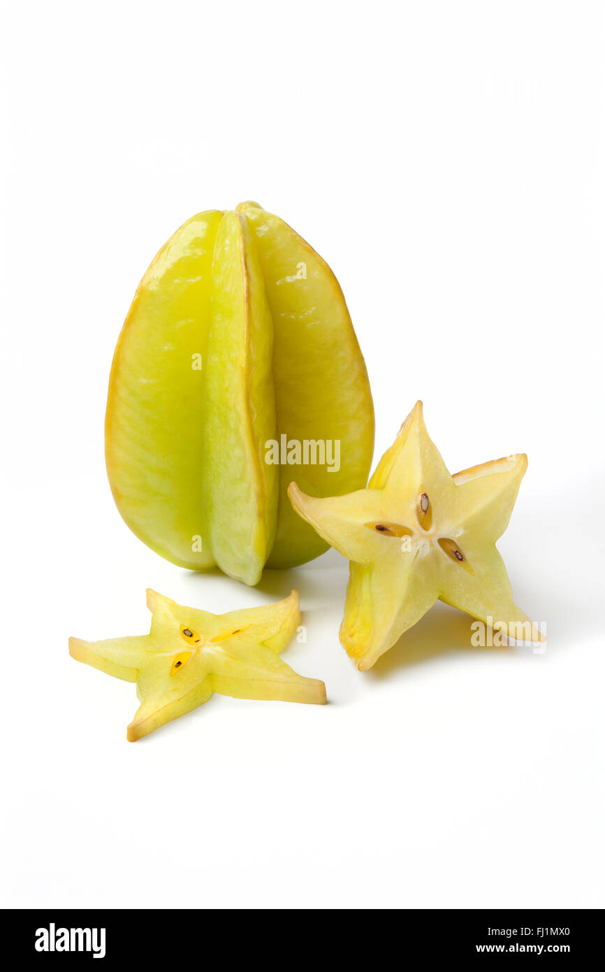Whole fresh ripe starfruit with slices on white background Stock Photo ...