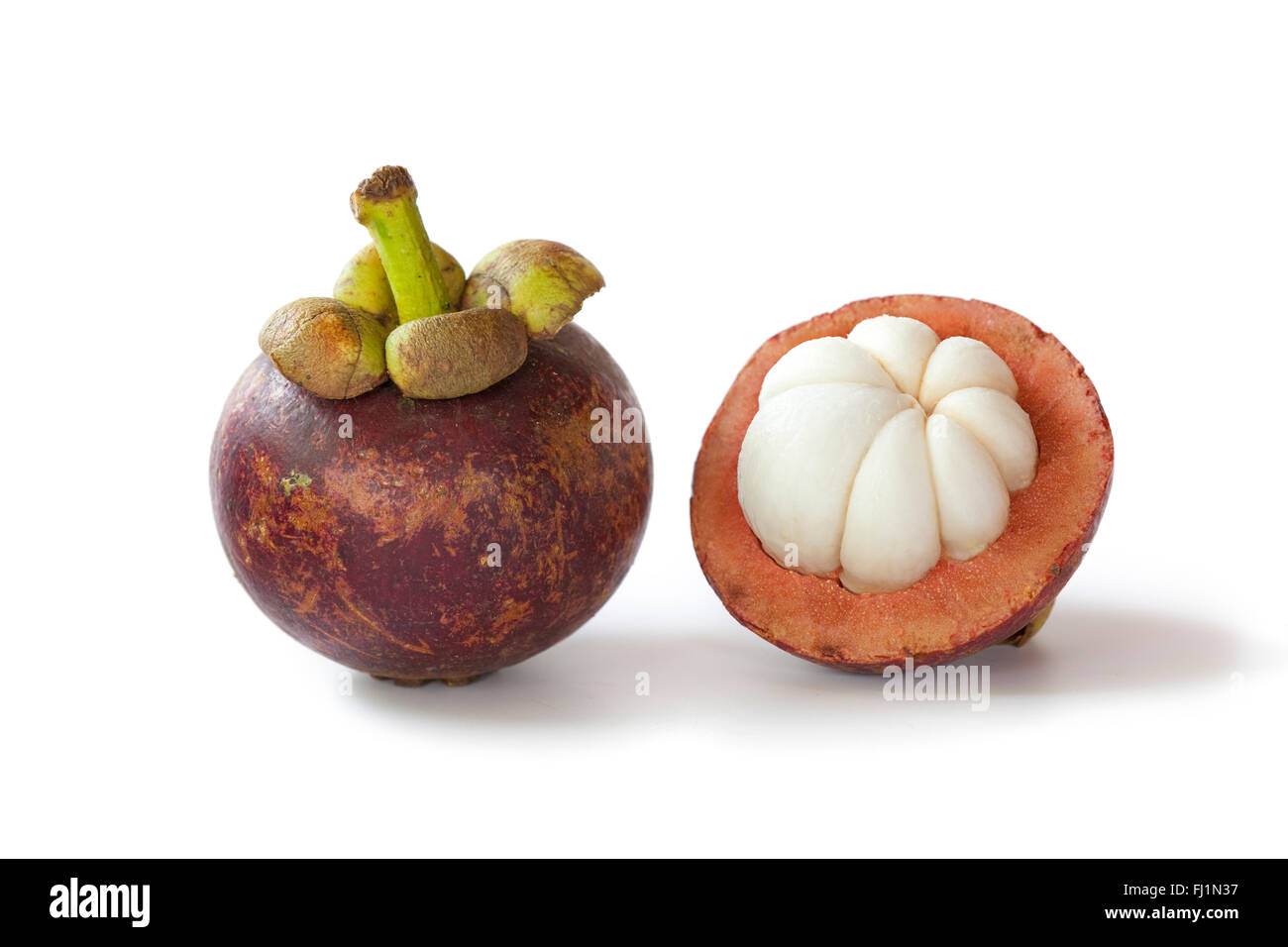 One and a half fresh mangosteen on white background Stock Photo - Alamy