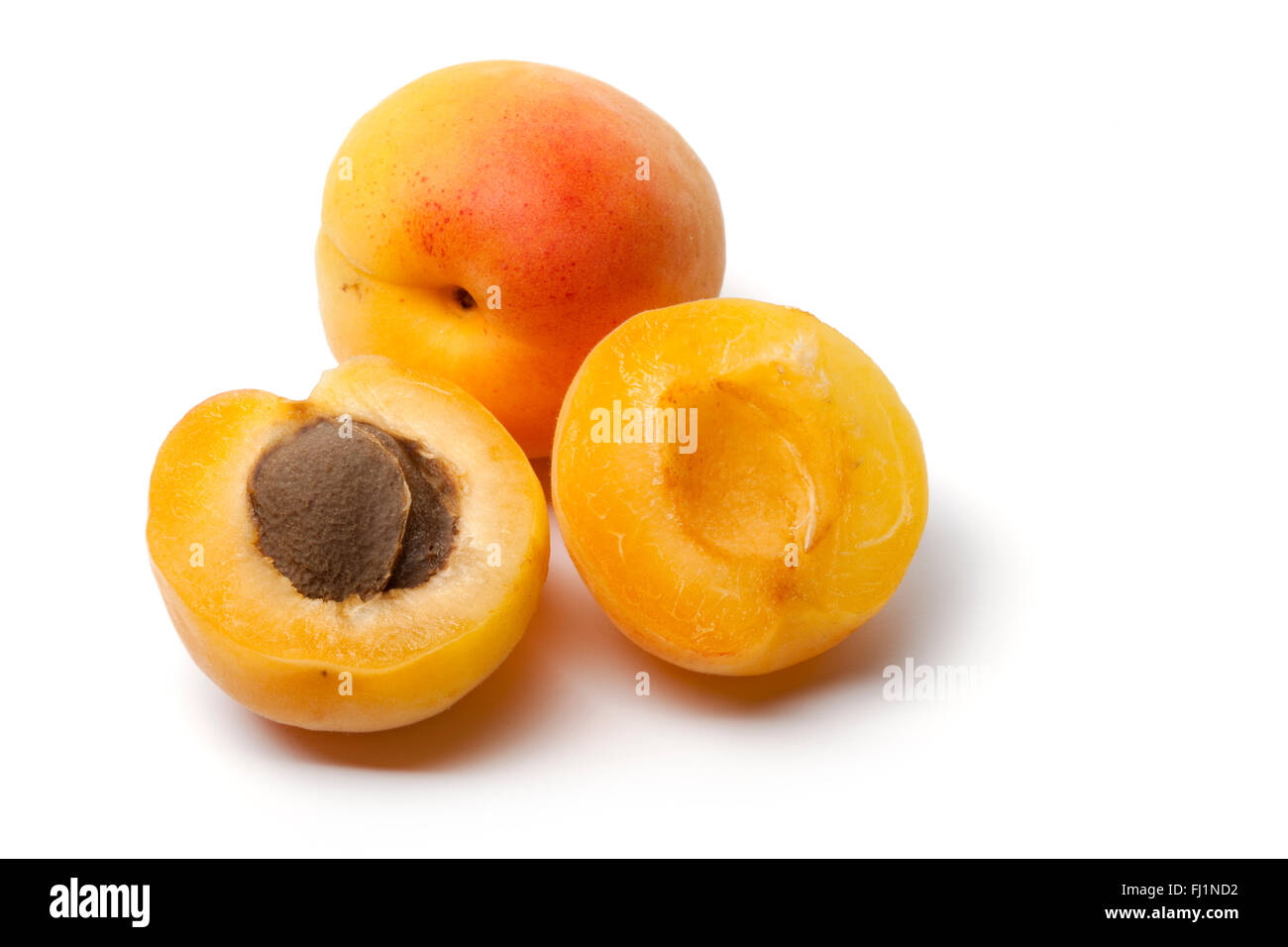 Whole and half fresh apricot isolated on white background Stock Photo ...