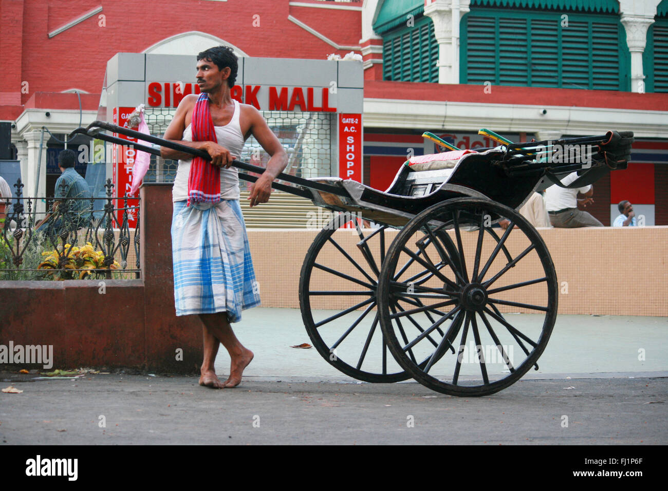 Rickshaw driver puller - hard work in Kolkata , India Stock Photo - Alamy