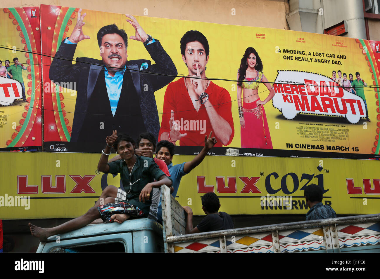 Young Indian guys say hello from the top of a truck in Kolkata , India ...