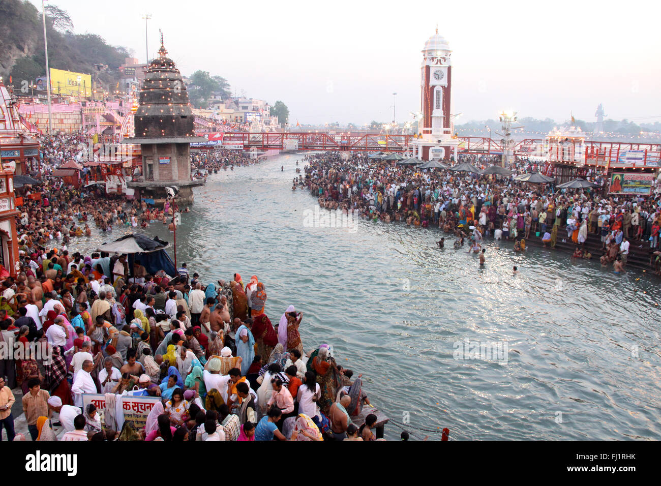 Crowd of Hindu people pilgrims at Har ki Pauri on the banks of the holy ...