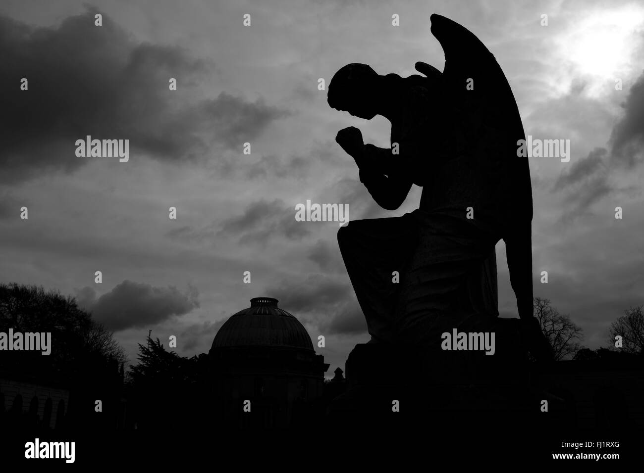 Angel kneeling Black and White Stock Photos & Images - Alamy
