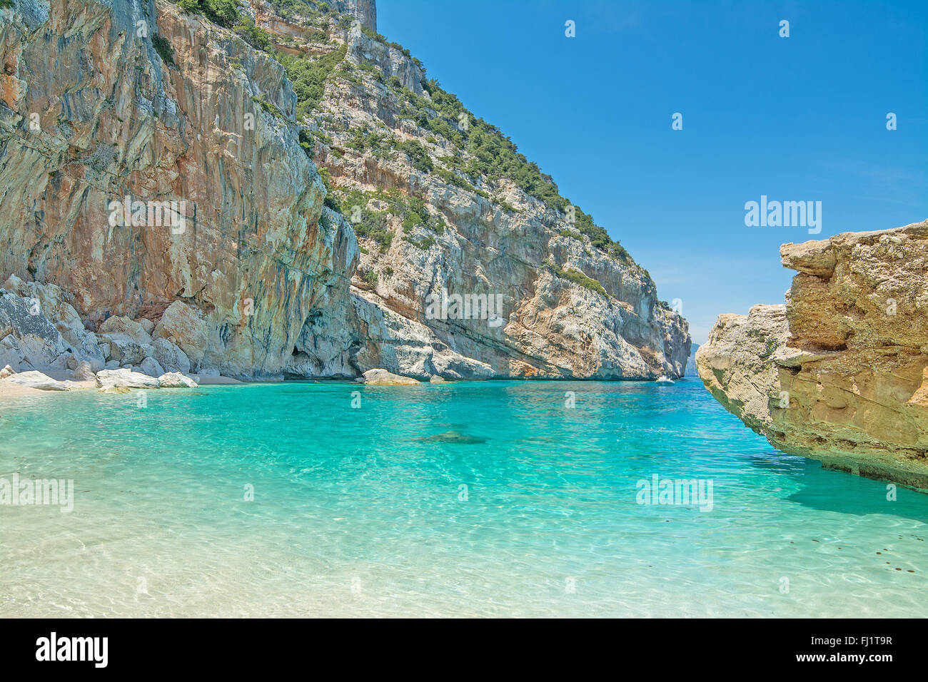 white sand, turquoise sea and rocks in Cala Mariolu, Sardinia Stock ...