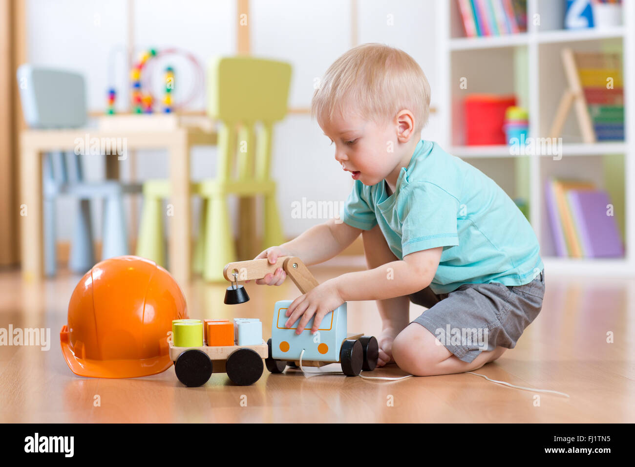 child boy toddler playing with toy car indoors Stock Photo - Alamy