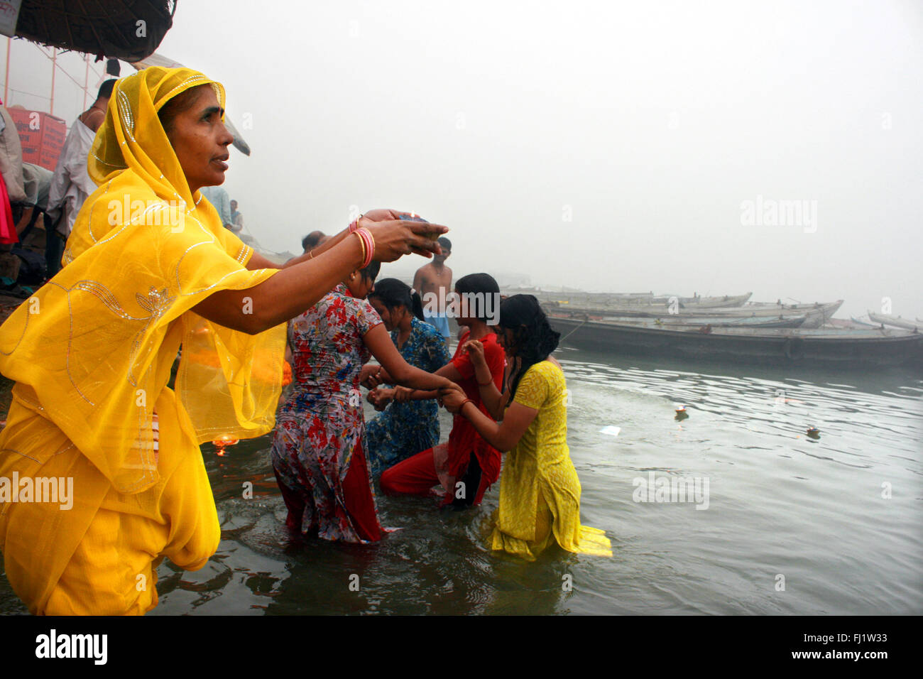 Group of women making puja ritual ona ghat of Varanasi, India Stock ...