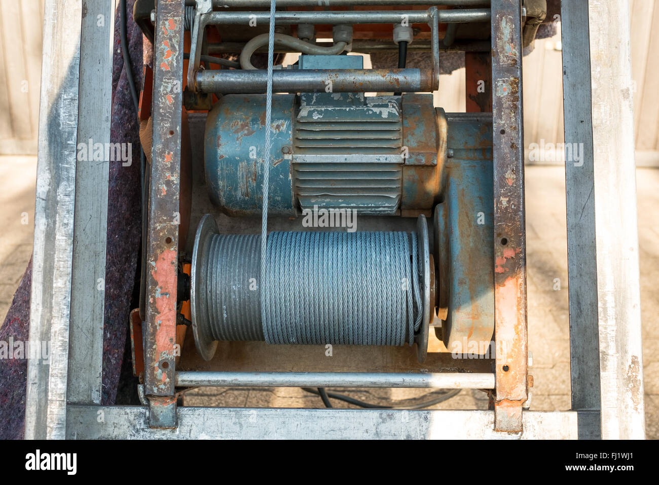 Electric cable winch with steel cable and electric motor Stock Photo ...