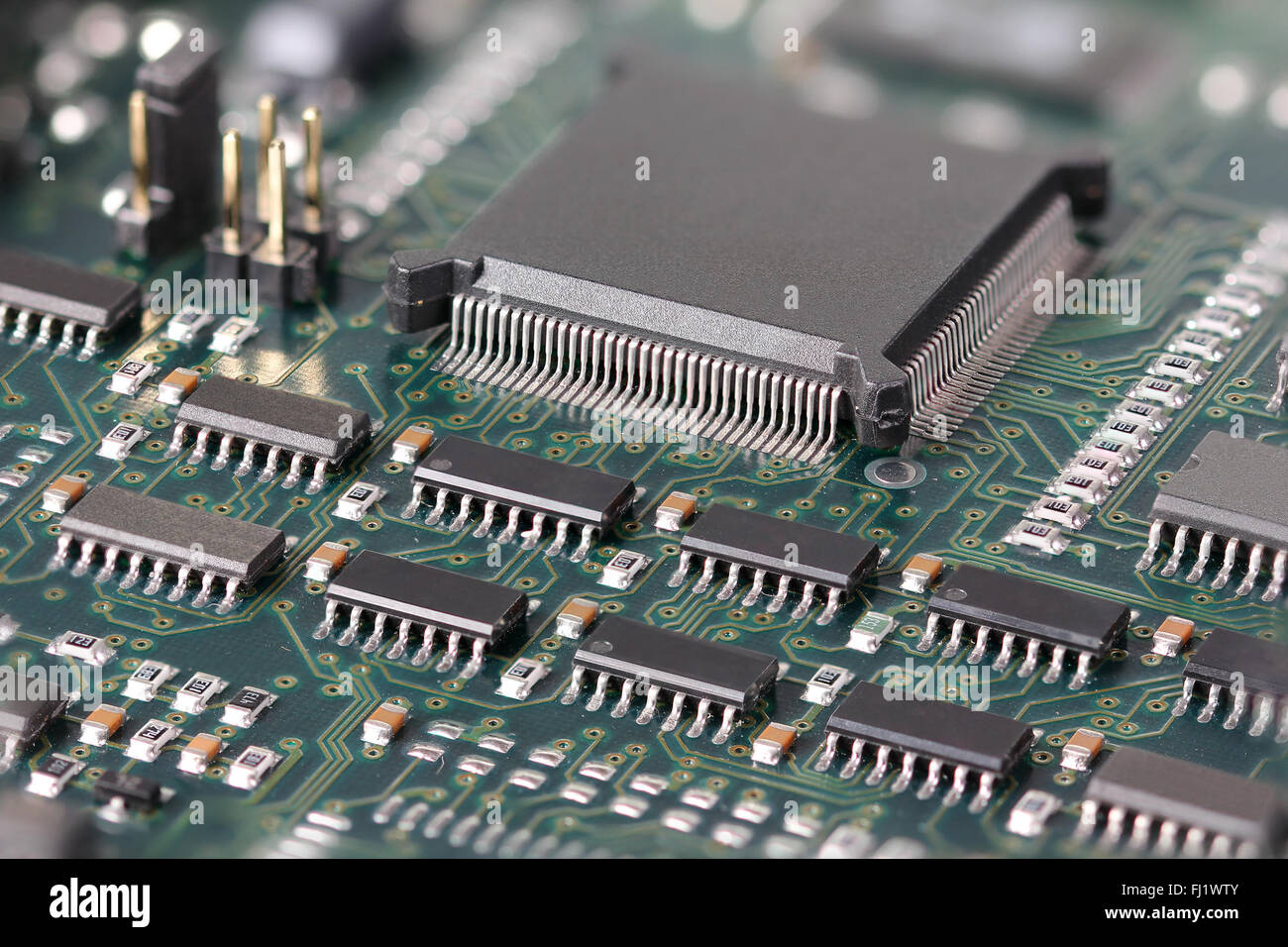 Green Circuit board with microprocessor and other electronic components ...