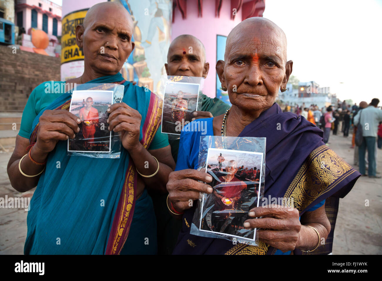 Three women are showing polaroid pictures of themselves that they have ...