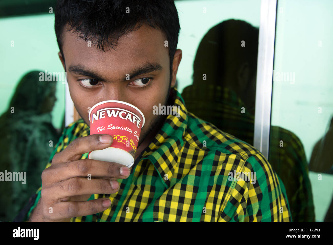Bangladesh man drinking Newcafé beverage inspired by Nescafé ...