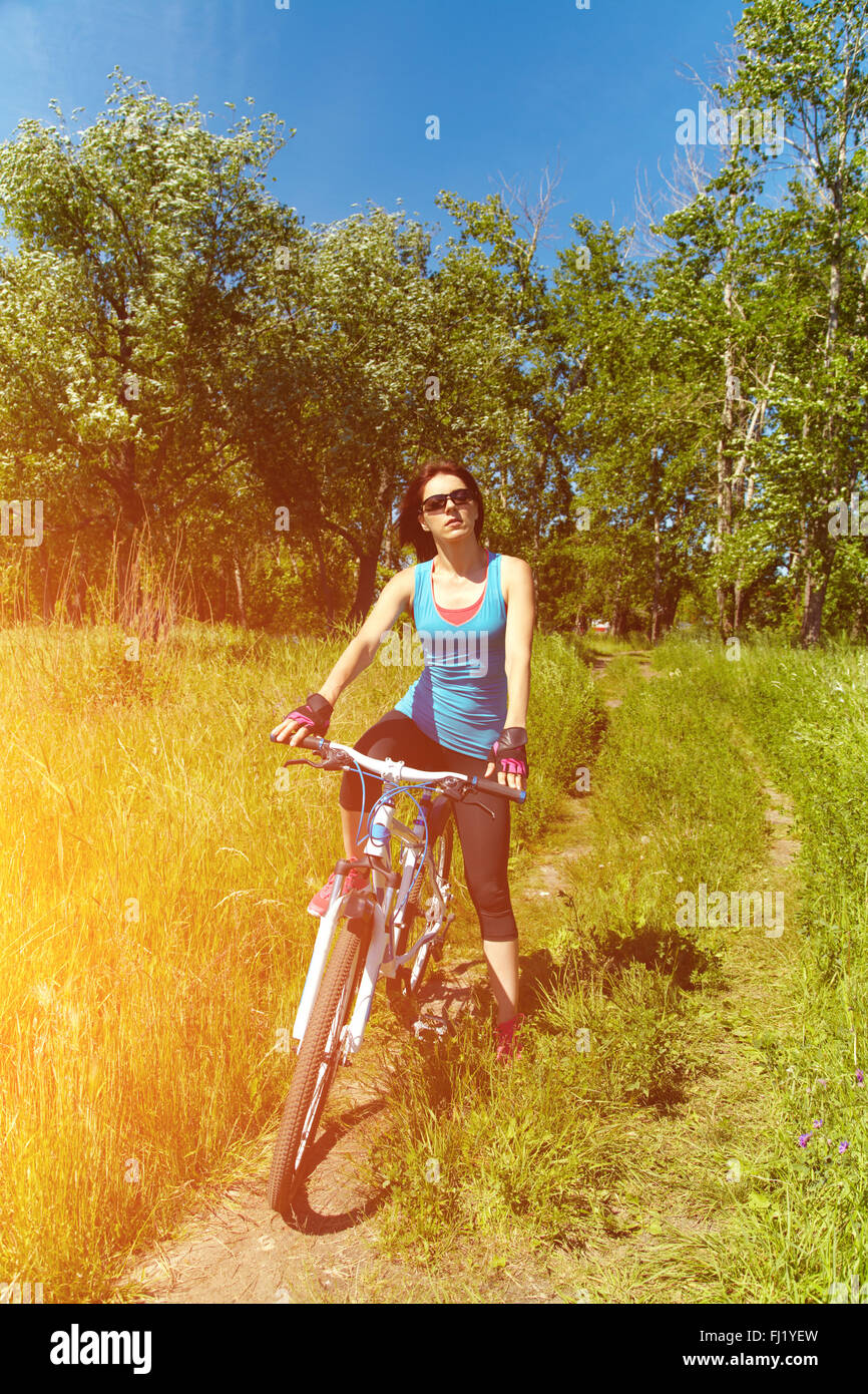 woman riding a bicycle Stock Photo - Alamy