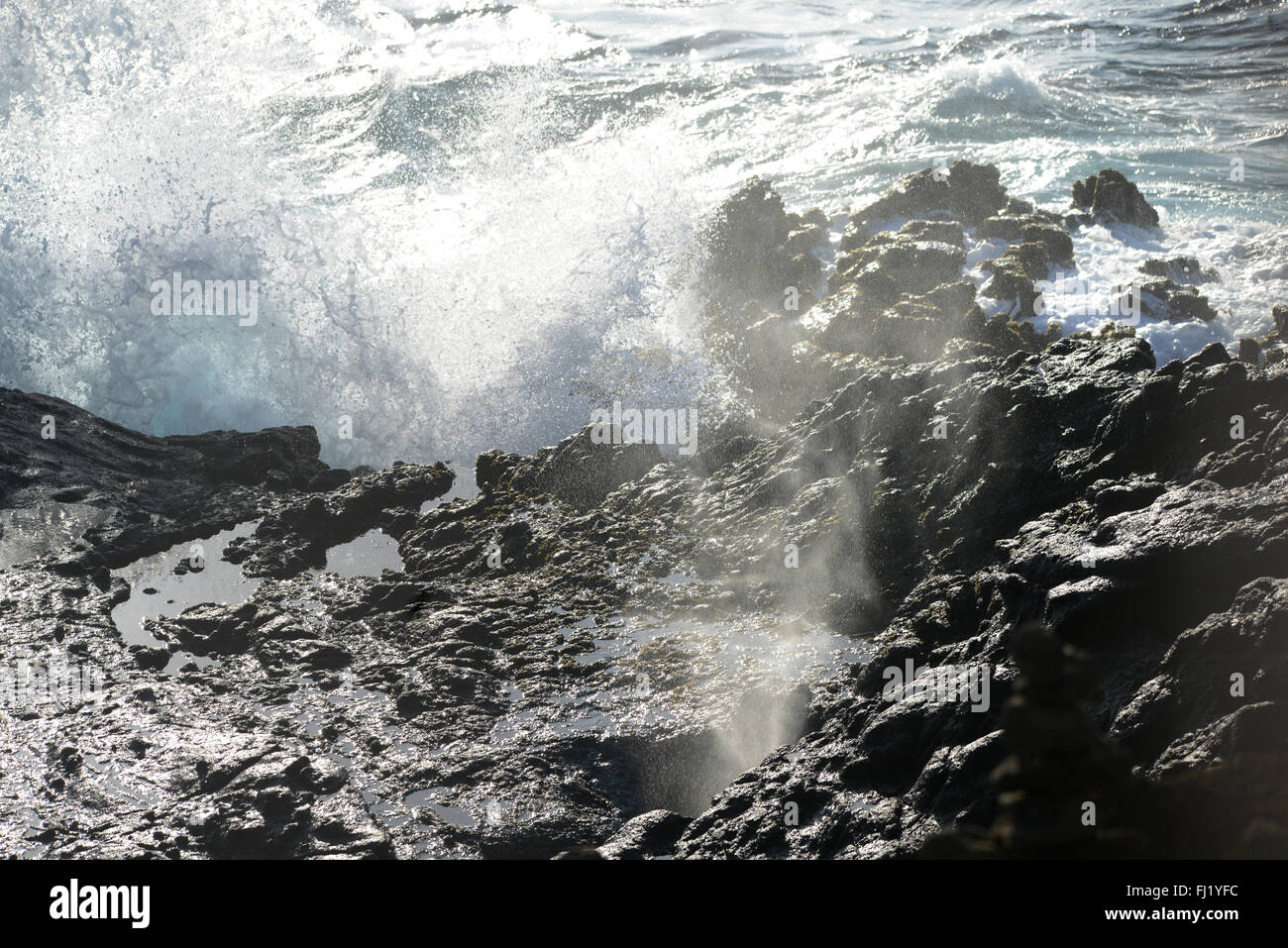 Ocean surf against rock in Oahu, Hawaii Stock Photo - Alamy