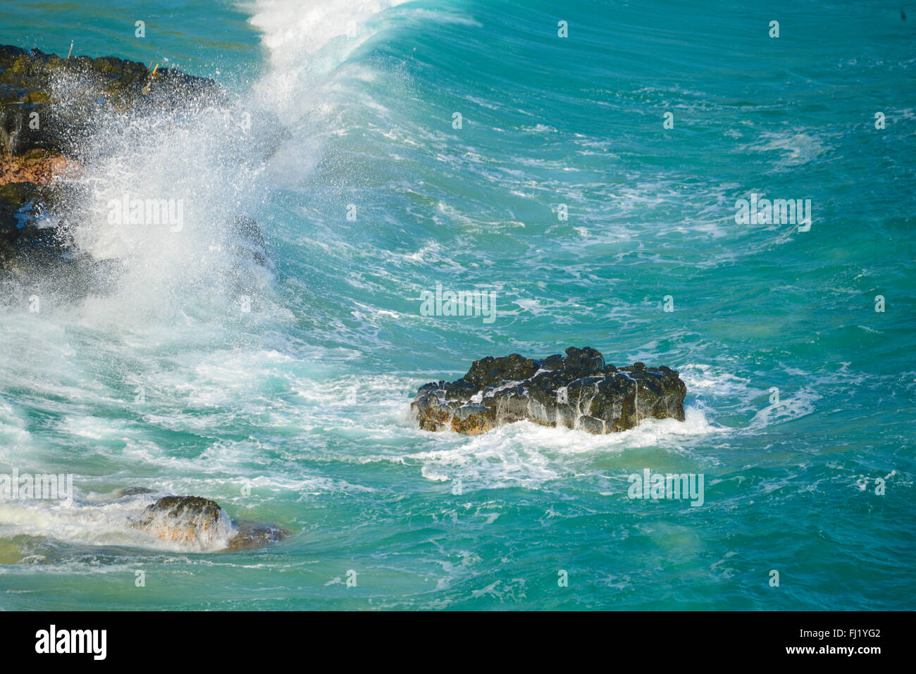 Ocean surf against rock in Oahu, Hawaii Stock Photo - Alamy