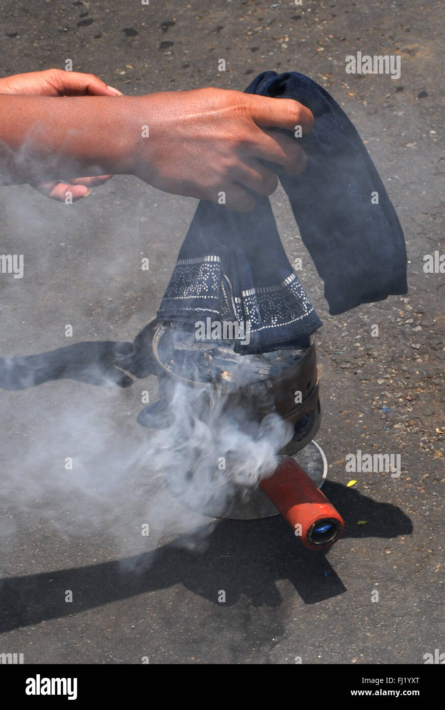 Malang, Indonesia. 28th Feb, 2016. Artist brings appliance burnt ...