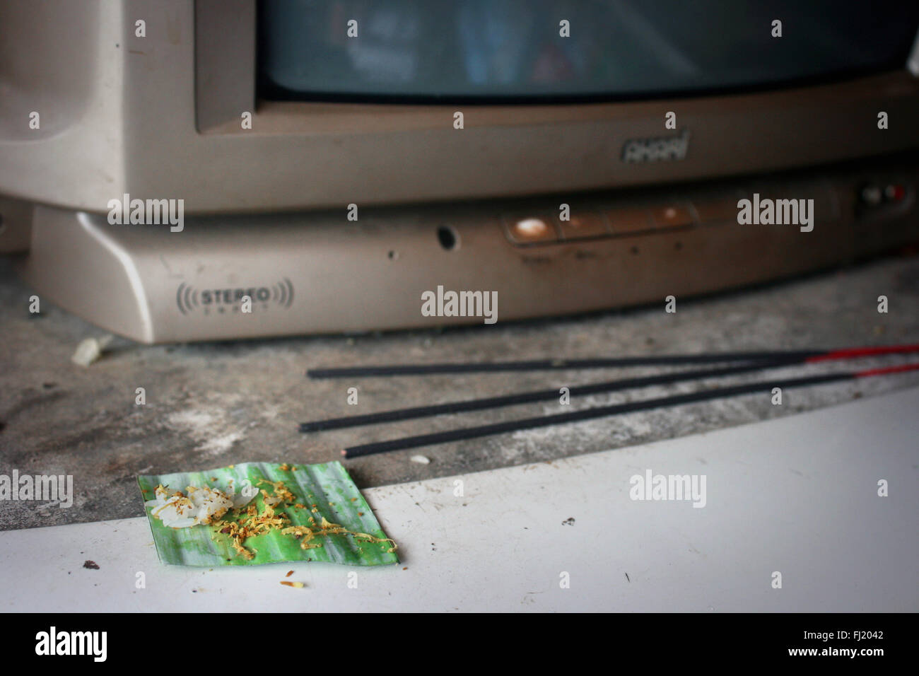 Incense sticks and grains of rice for a spiritual purpose near ...