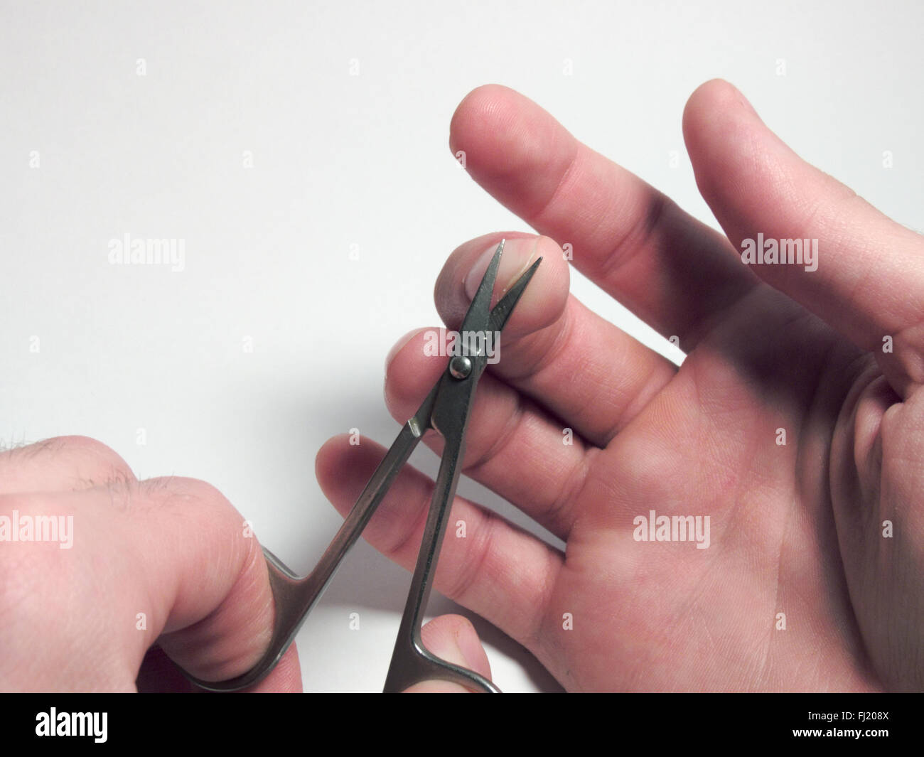 nail scissors, cutting nails, man's hand Stock Photo - Alamy