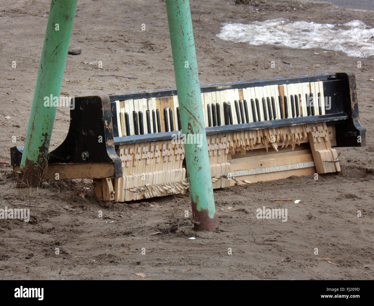 The broken piano keyboard, thrown in the yard on sand Stock Photo - Alamy
