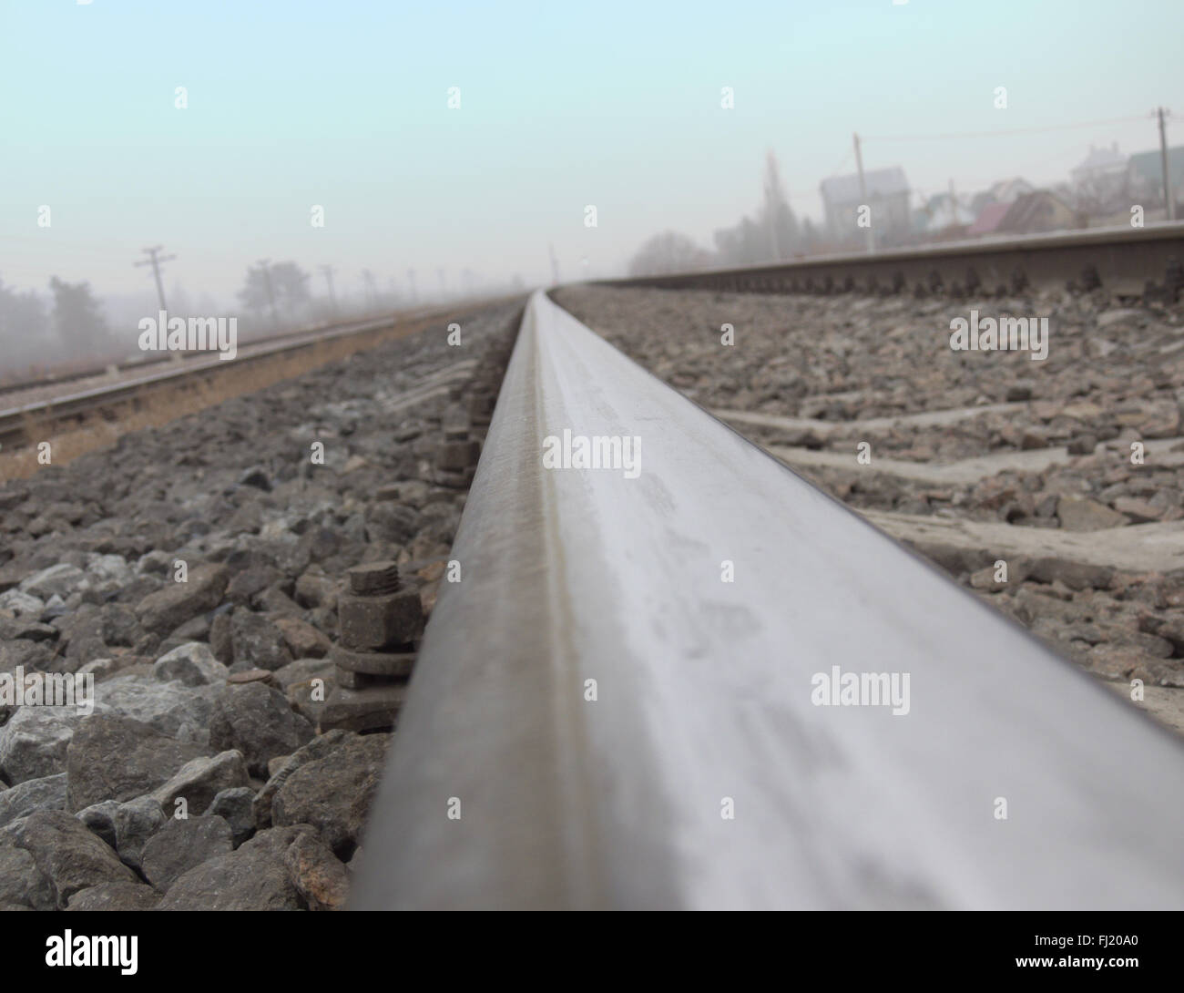 Rails, stretching to the horizon, photographed by a camera, placed on ...