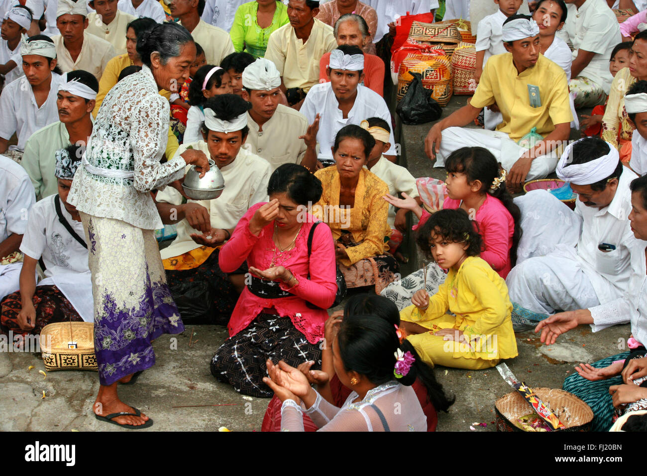 Hindu Balinese people praying during Kuningan ceremony in Ubud, Bali ...