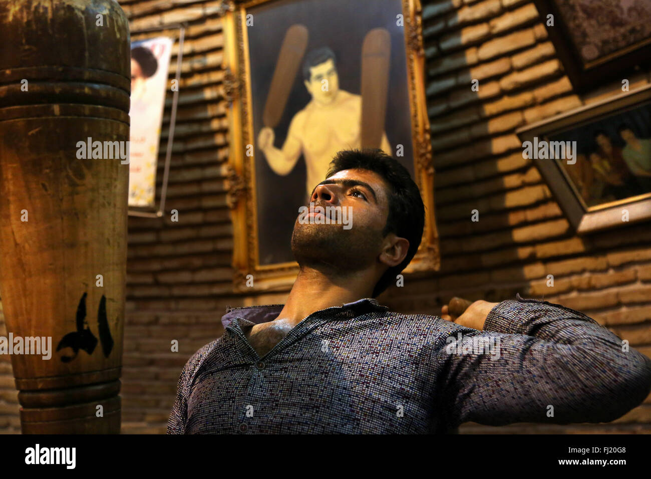 Portrait of Iranian man training at Zurkhaneh - Traditional Iranian ...