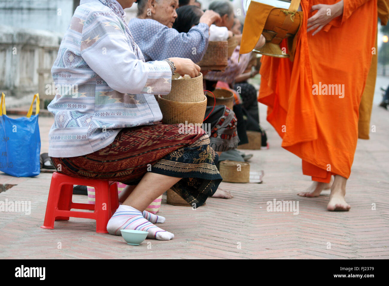 Tak bat ceremony in the morning - Buddhist monks receive rice and food ...
