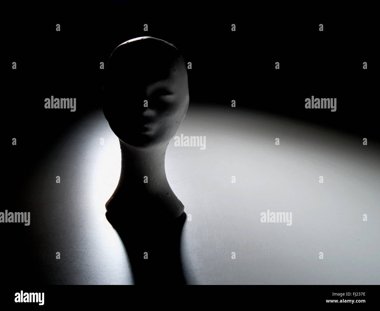 White dummy female head on black background Stock Photo - Alamy
