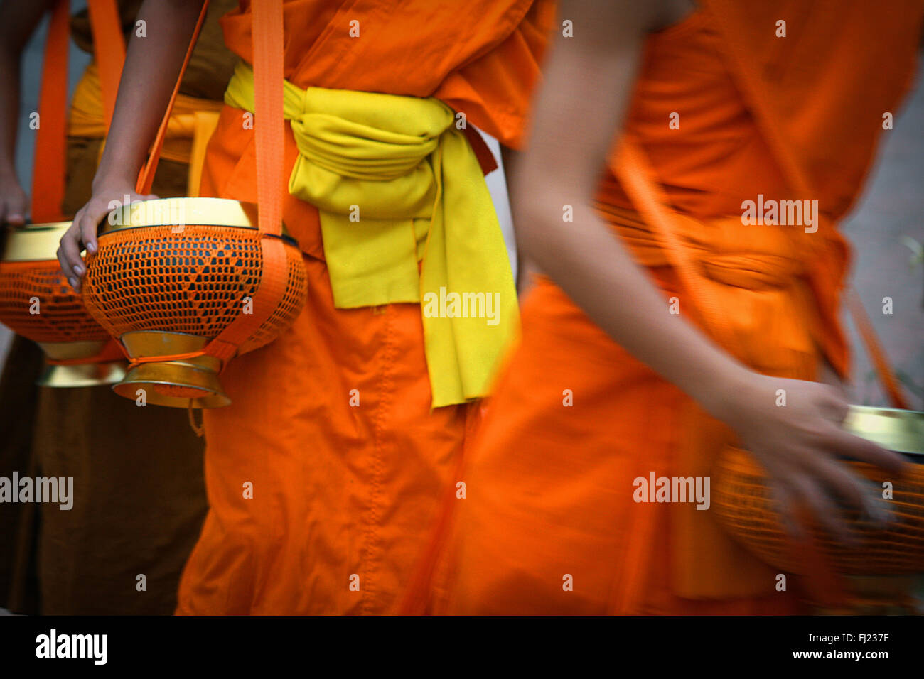 Tak bat ceremony in the morning - Buddhist monks receive rice and food ...