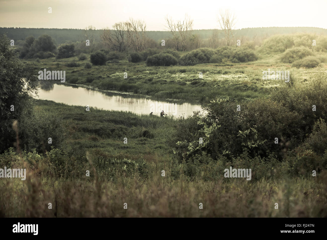 Rural landscape with narrow river during sunrise Stock Photo - Alamy