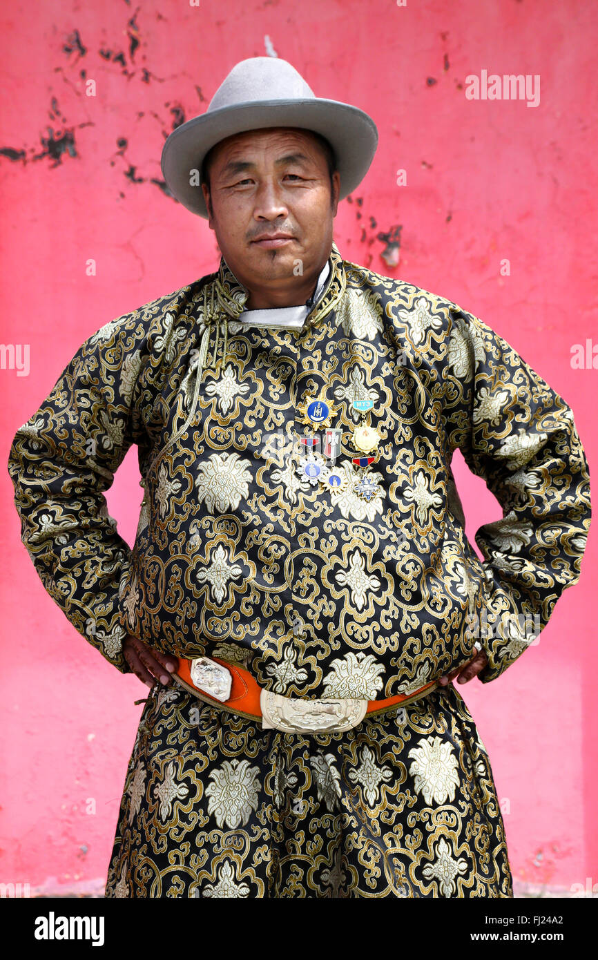 Portrait of Mongolian man with traditional costume dress called "deel ...