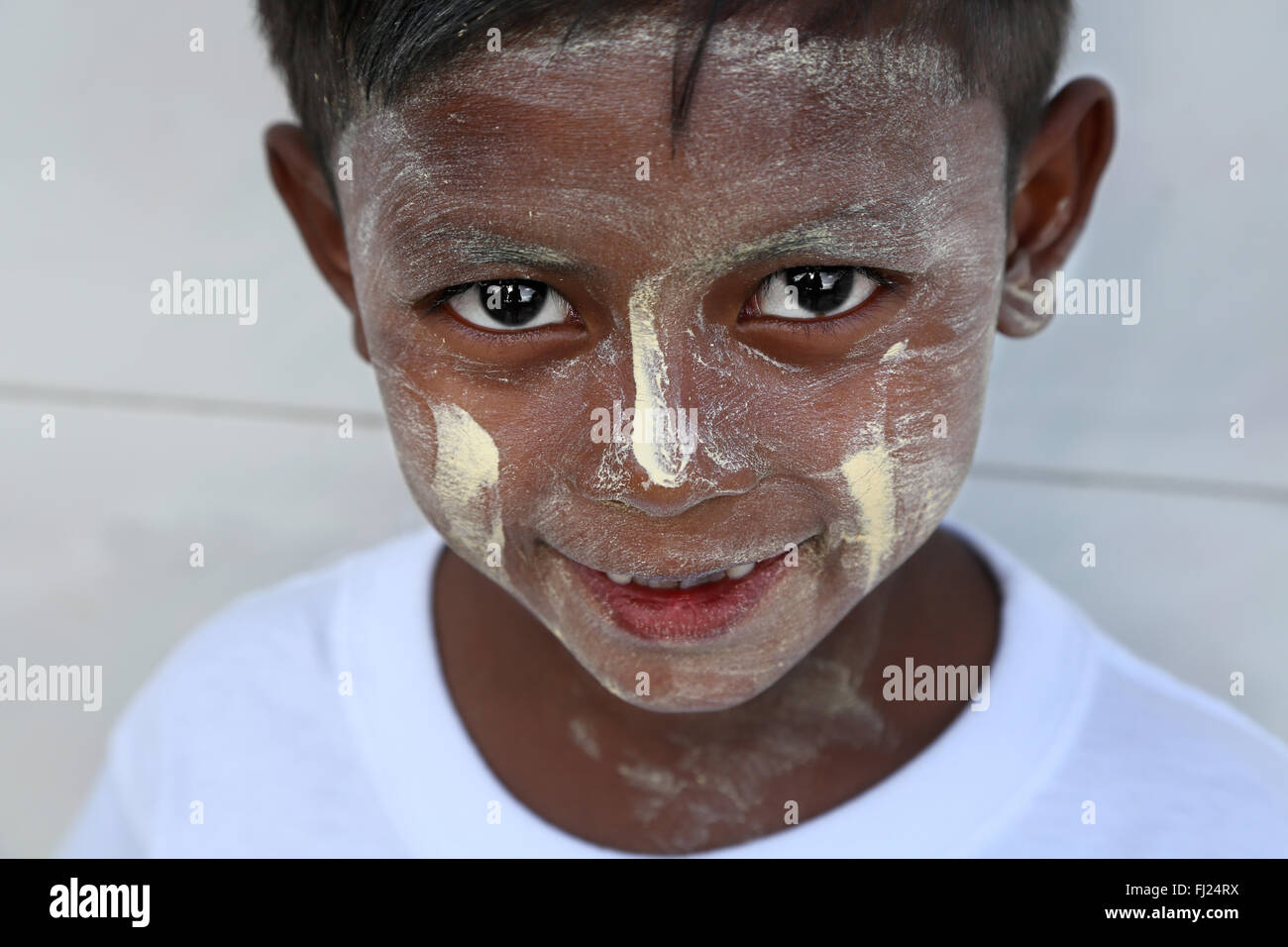 Portrait of Burmese kid with thanaka powder on his face Rangoon Myanmar Stock Photo Alamy