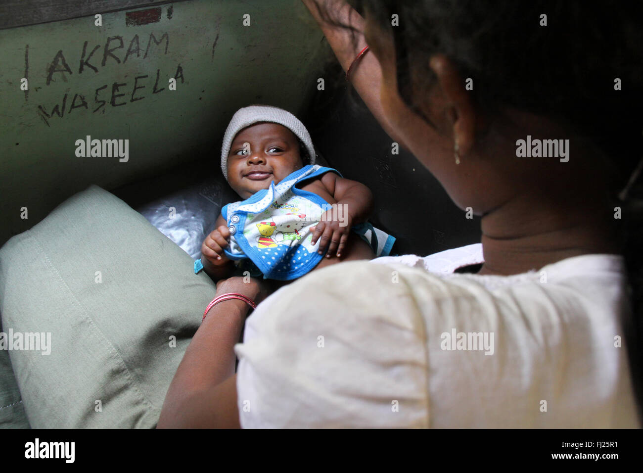 Mother and her child baby in local train in Sri Lanka Stock Photo - Alamy