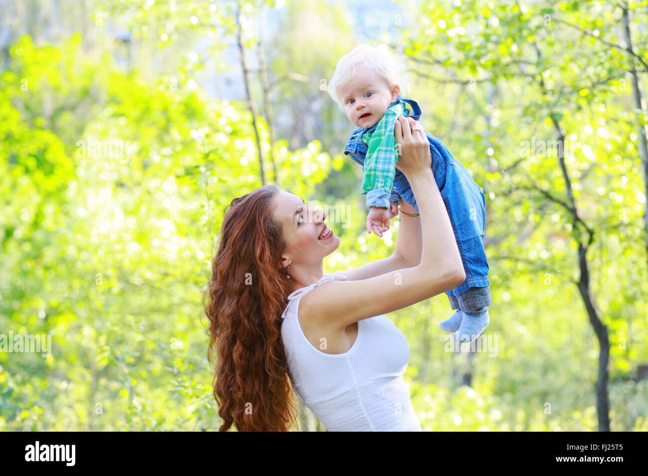 Mom playing with baby on outdoors Stock Photo - Alamy