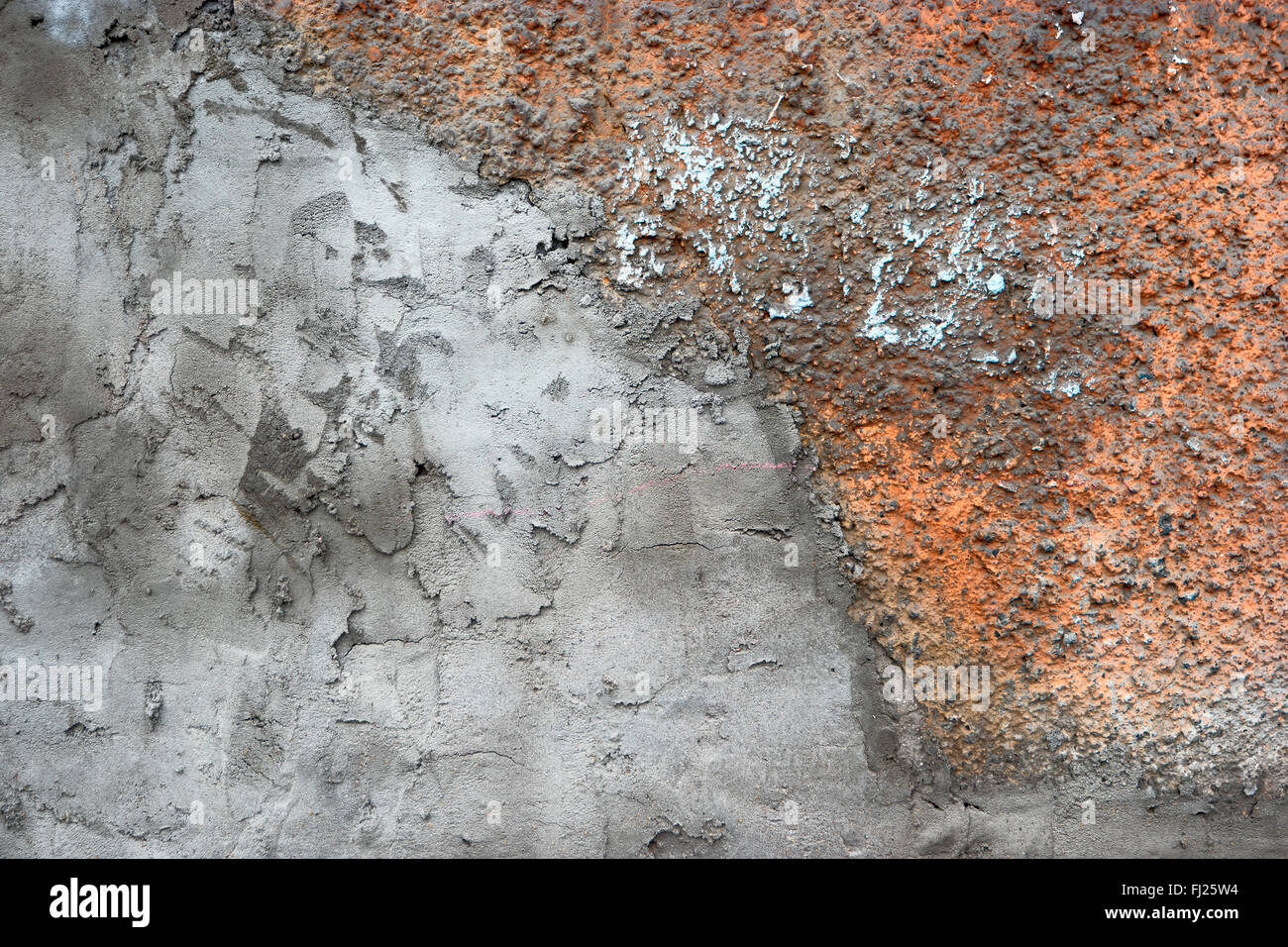 Half covered with plaster, half concrete wall Stock Photo - Alamy