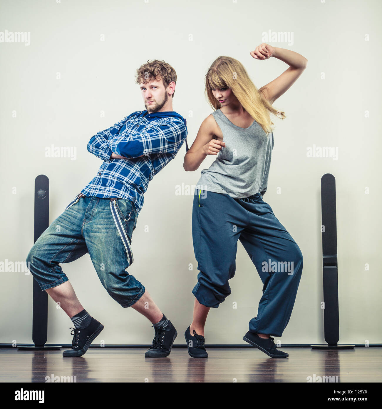 Two modern dancers couple woman and man dancing. Urban lifestyle. Hip ...