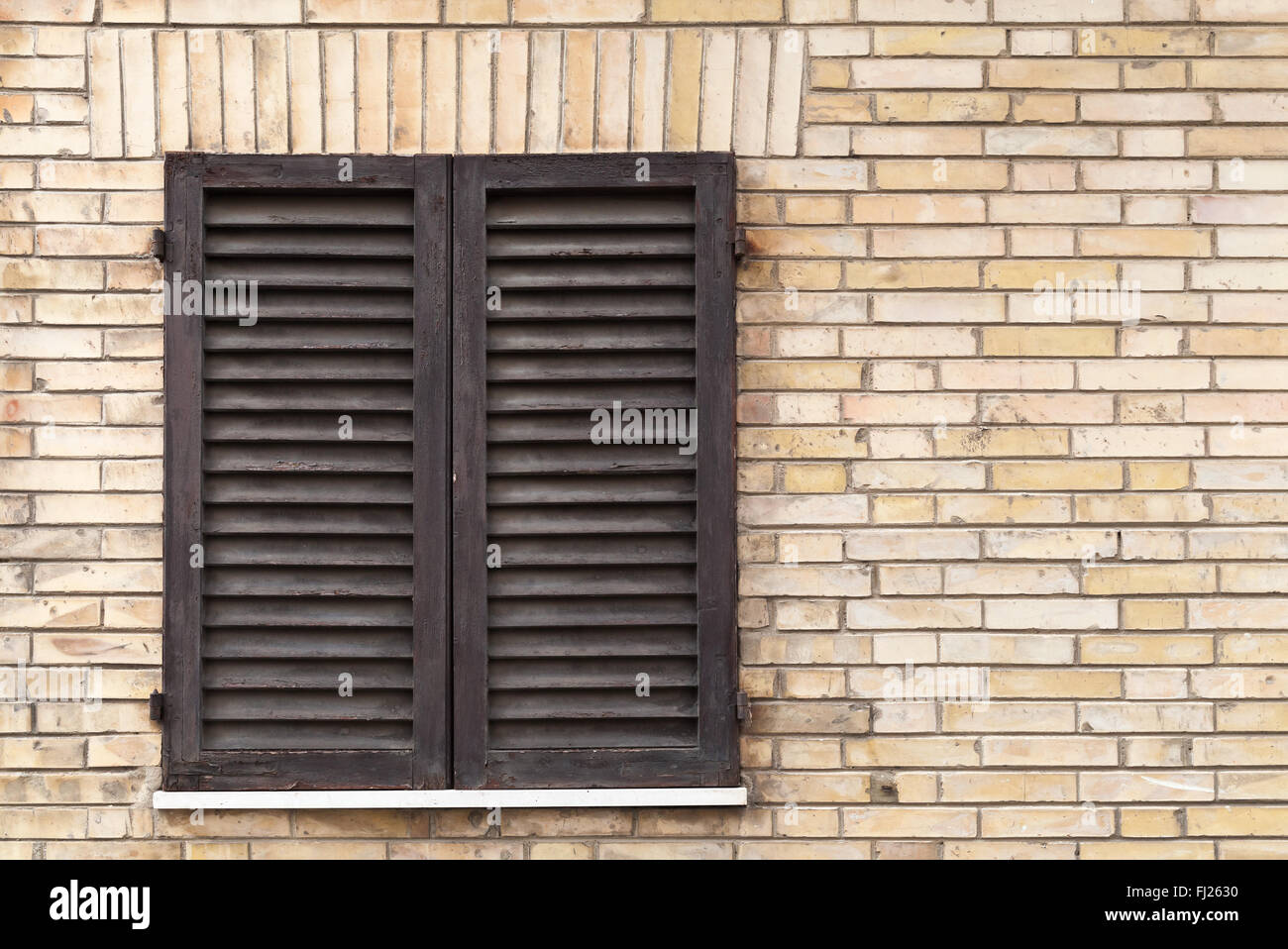 Old window with wooden shutters in brick wall, background photo texture ...
