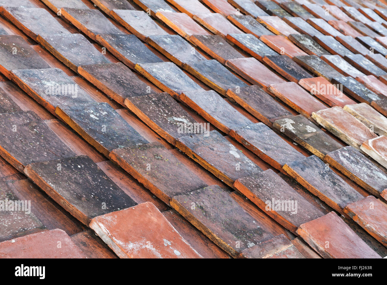 Old weathered red roof tiling background texture Stock Photo - Alamy