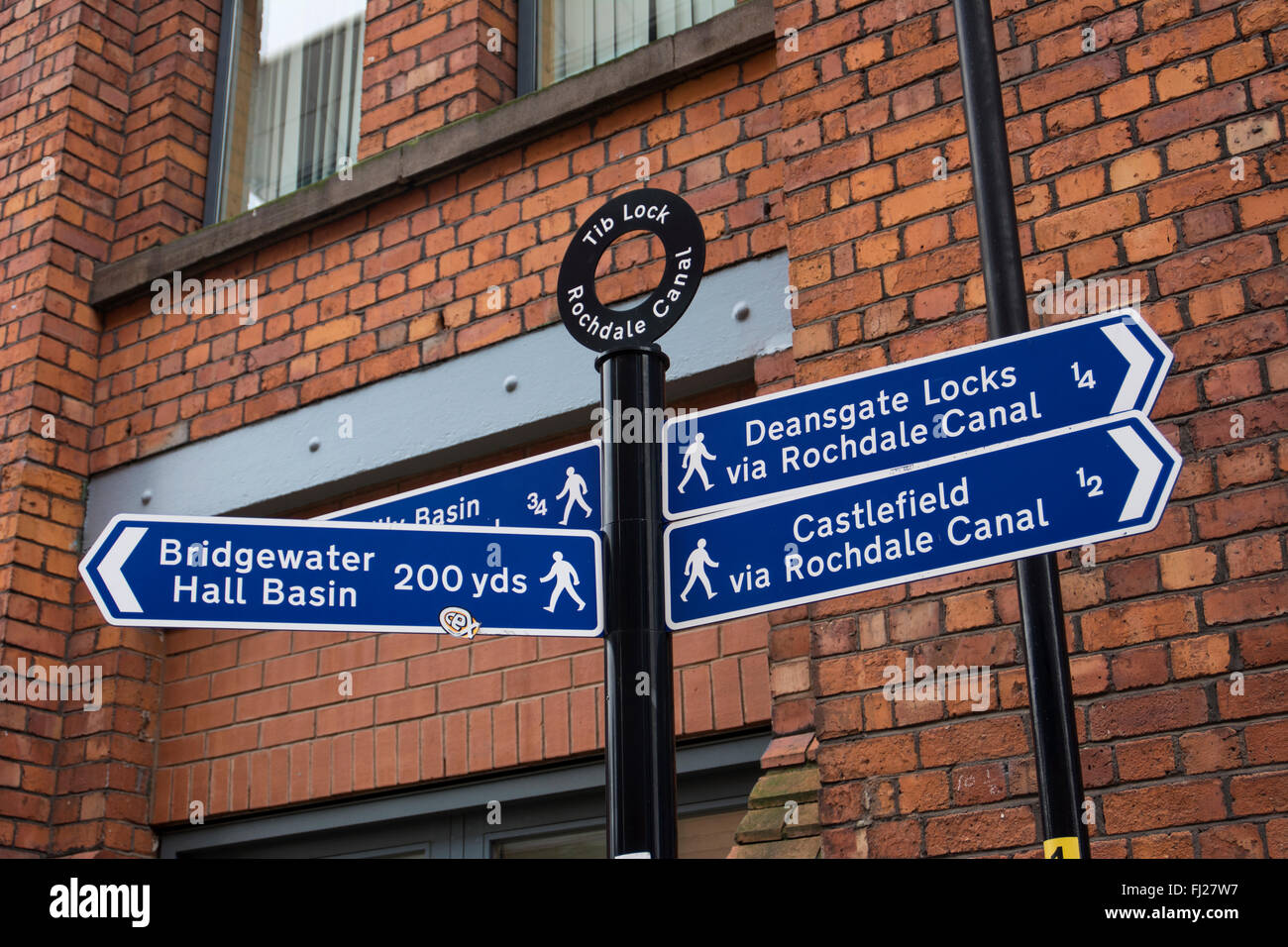 Signpost beside the Rochdale canal in the centre of Manchester Stock ...
