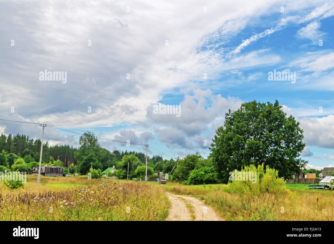 Village landscape with sand road Stock Photo - Alamy
