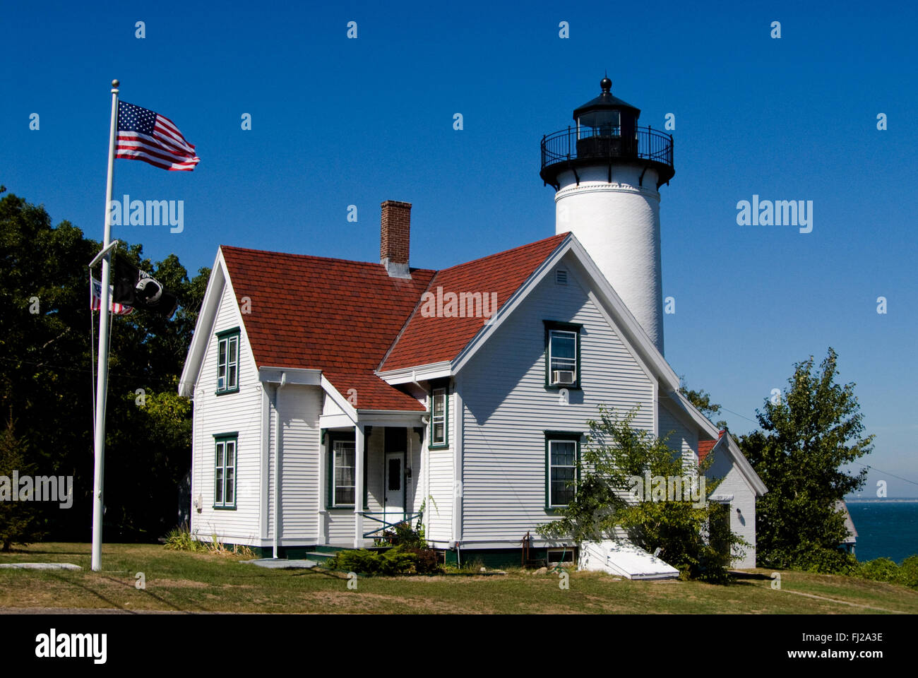 West Chop Lighthouse with American flag on a summer day in Martha's ...