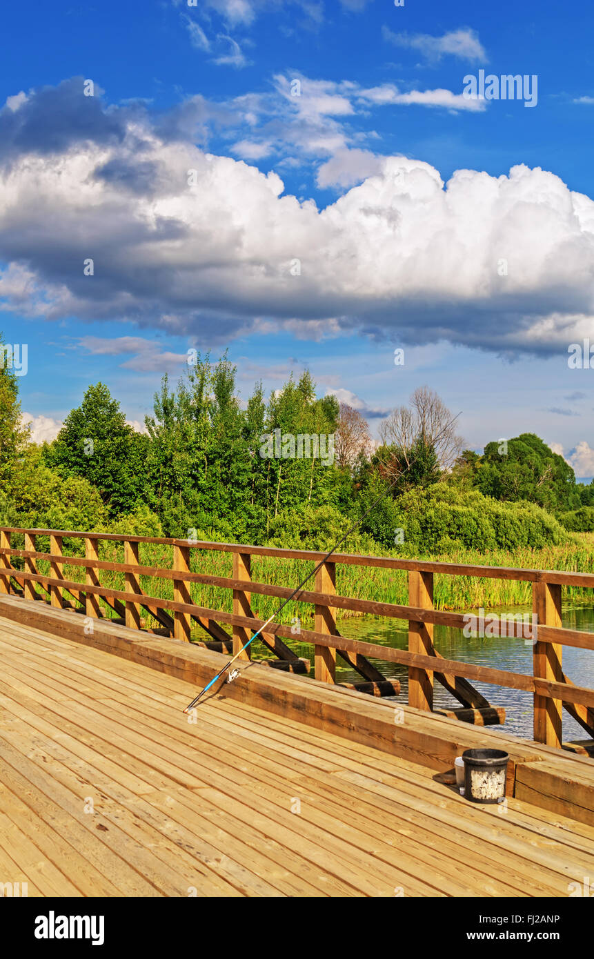 Village landscape with wooden bridge Stock Photo - Alamy