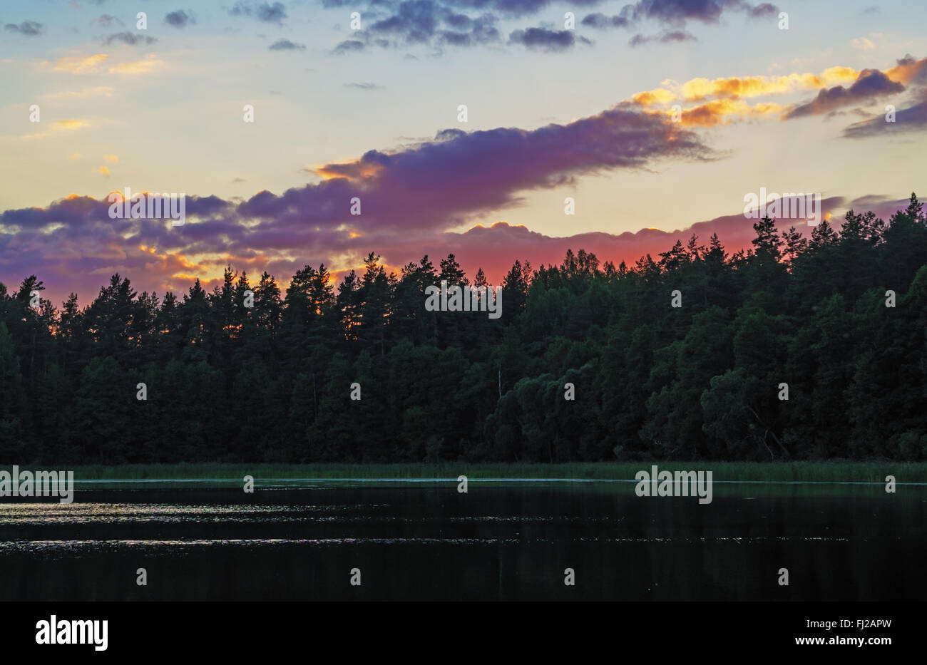 Pink sunset over lake Stock Photo - Alamy