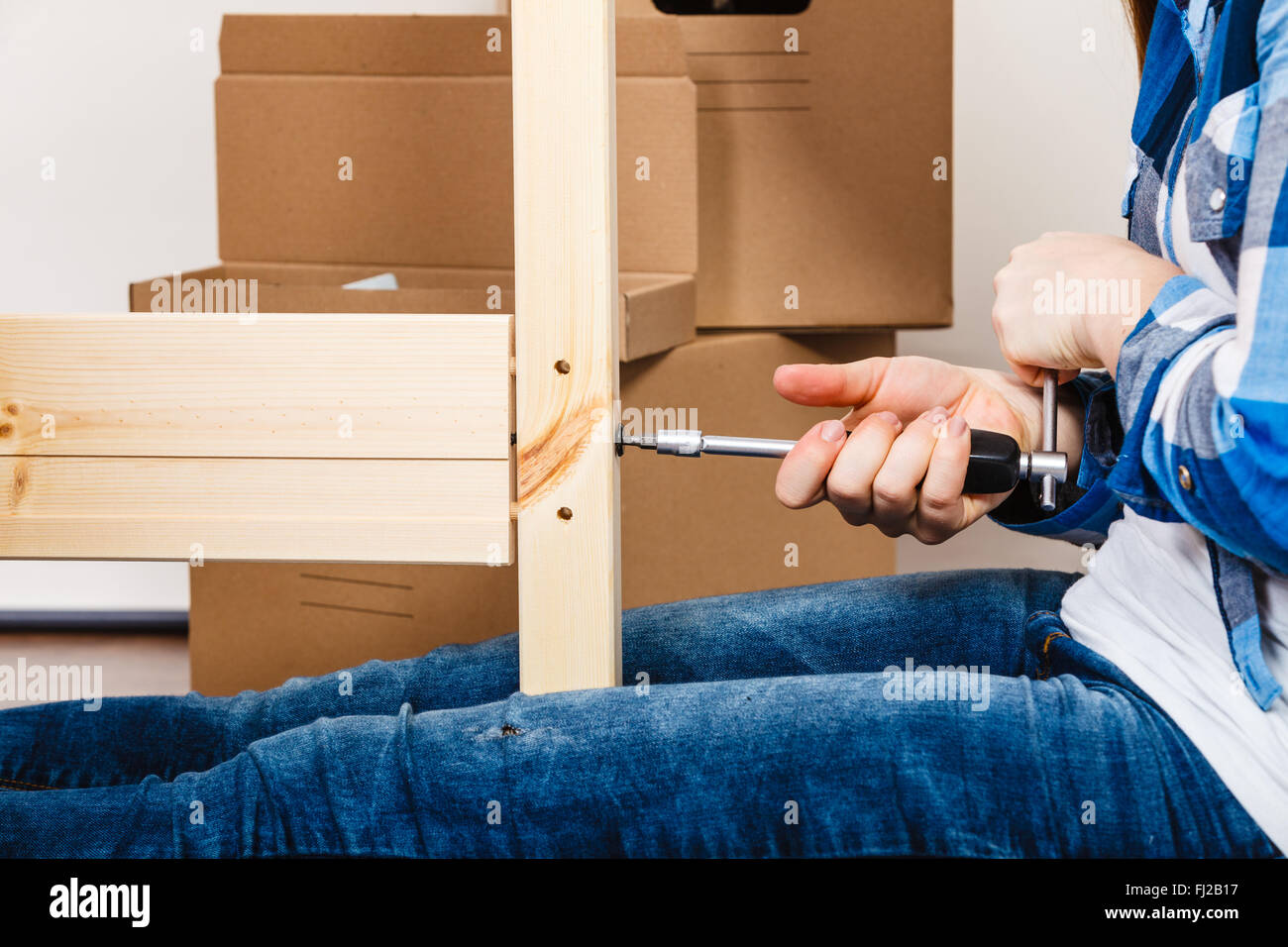Human Hand Assembling Wood Furniture Using Screwdriver Diy Enthusiast