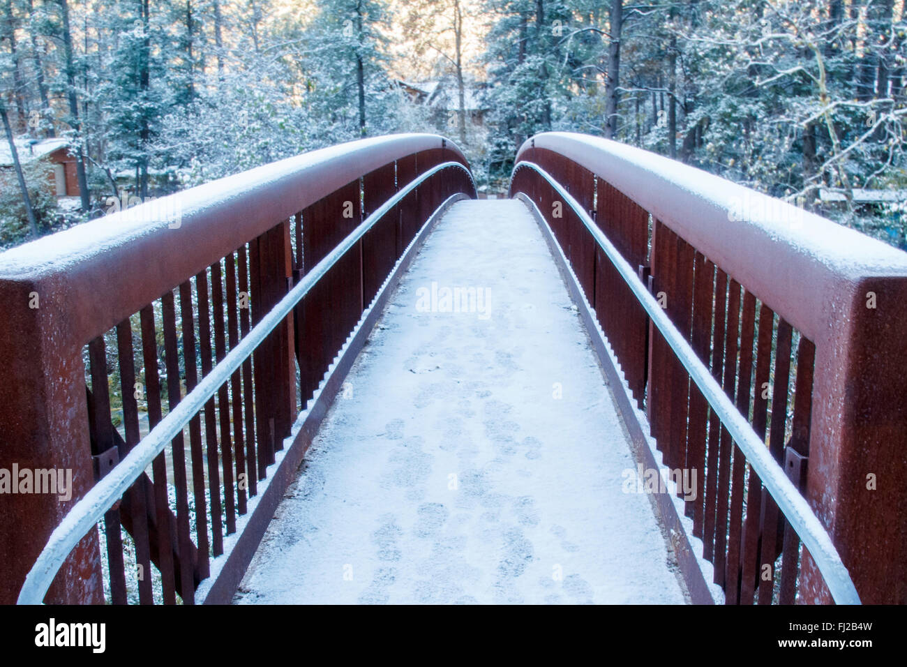 Snow covered foot bridge crossing Oak Creek, just North of Sedona ...